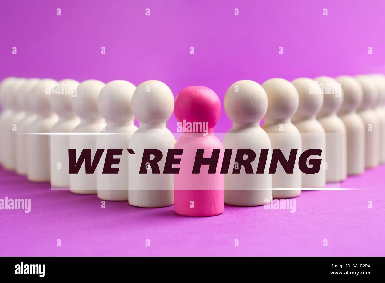 We Are HIring announcement. Pink figure among white ones on violet ...