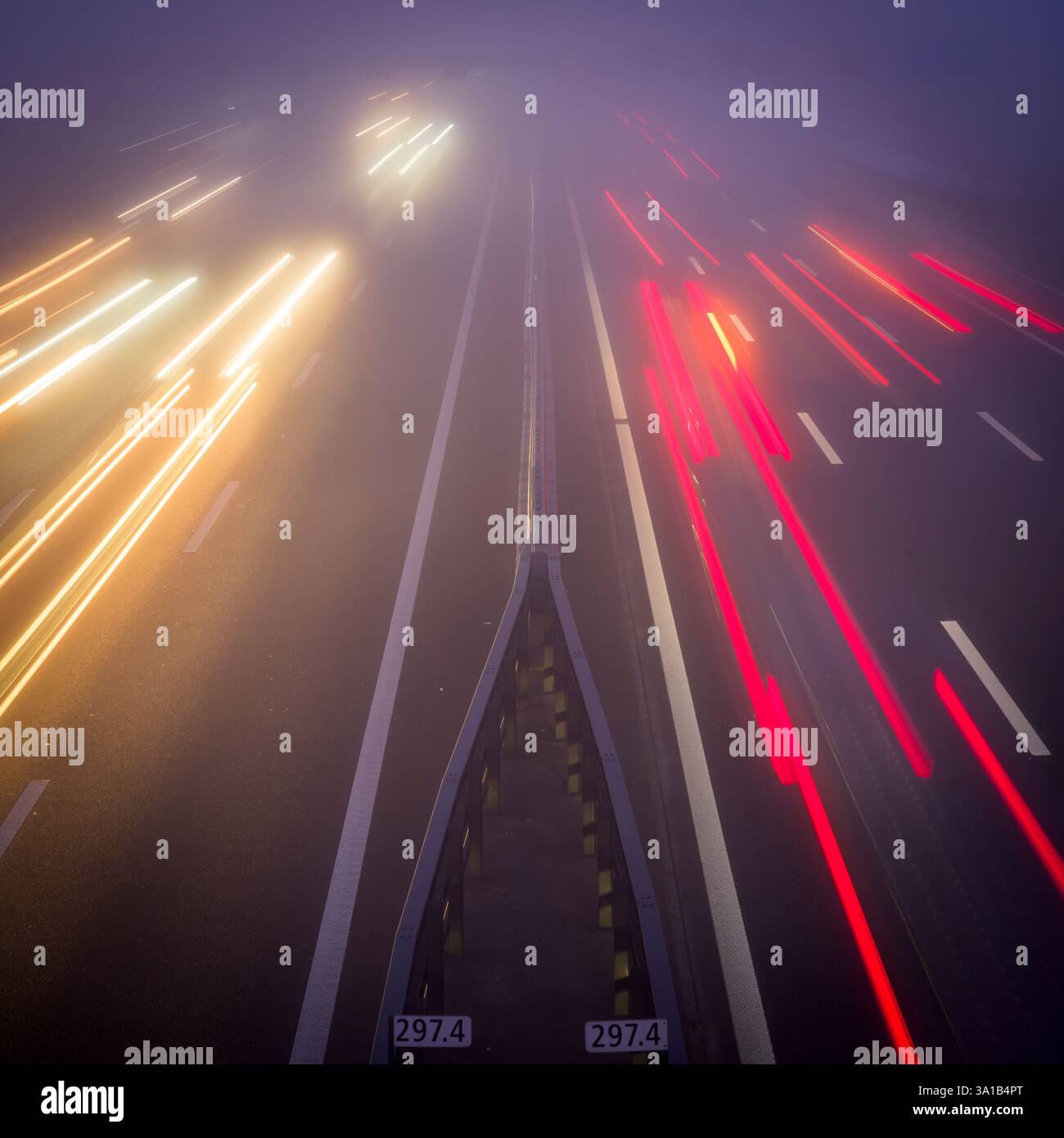 Light trails in the fog on the highway Stock Photo - Alamy