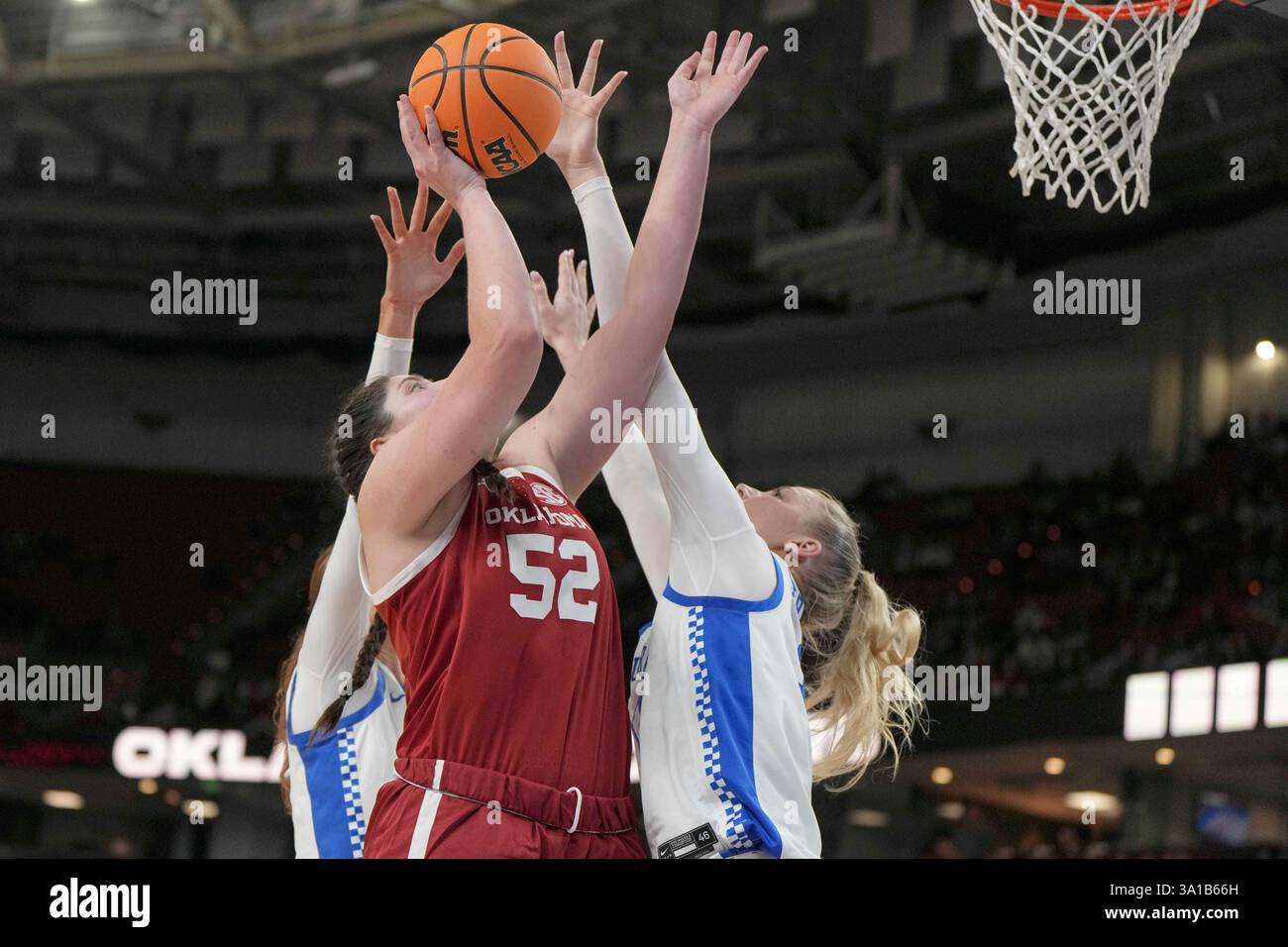 Oklahoma center Raegan Beers (52) shoots over Kentucky defenders during ...