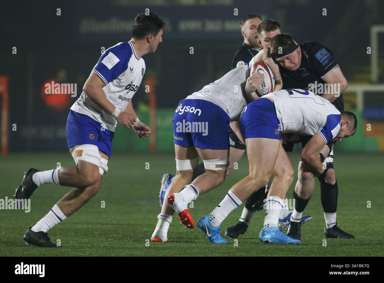 Newcastle Falcon's Freddie Lockwood, is tackled by Bath defenders ...