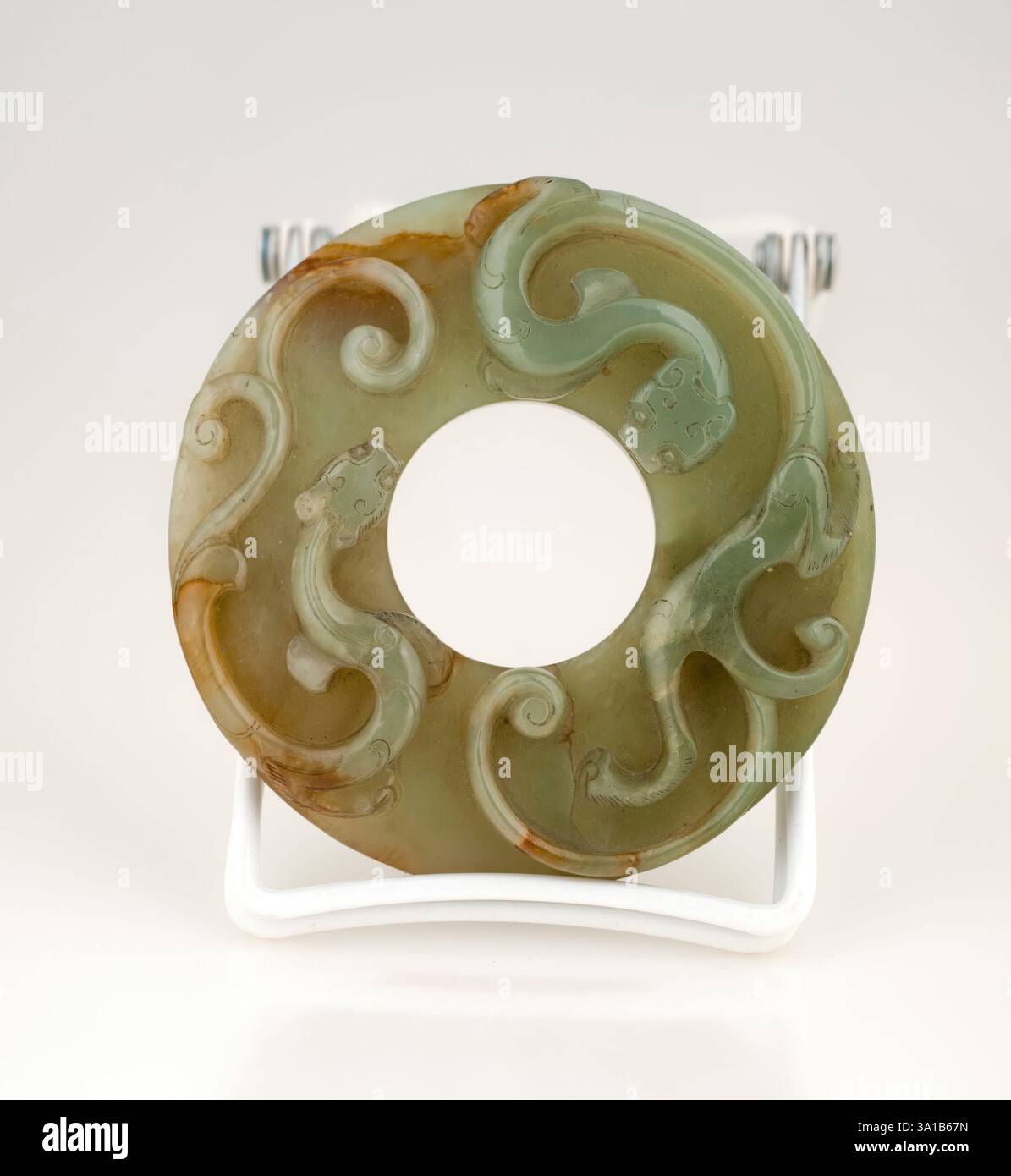 Disc with two animals in relief Stock Photo - Alamy