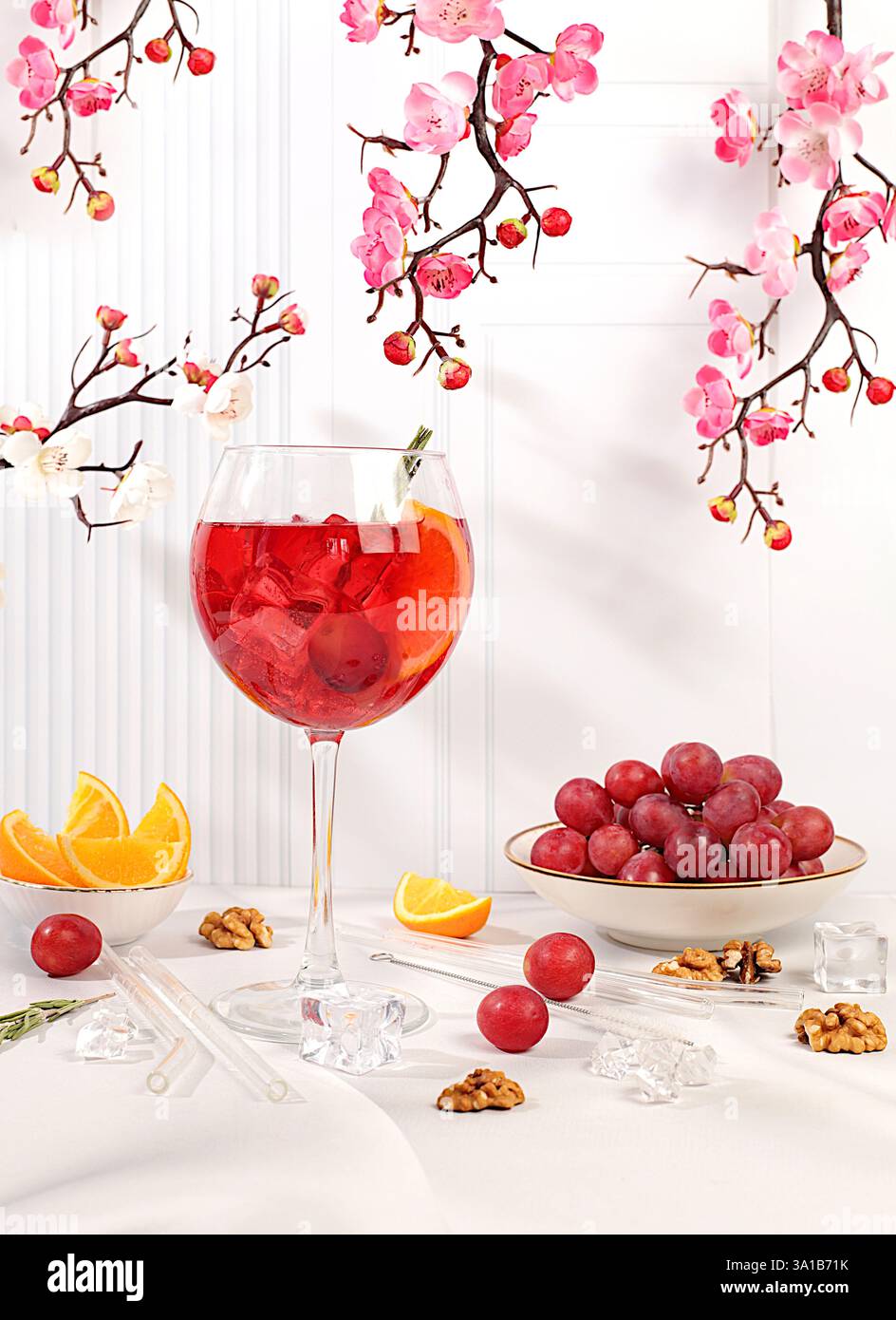 Royal lemonade cocktail with tequila, gin, rum, ice and grapes, bar and ...