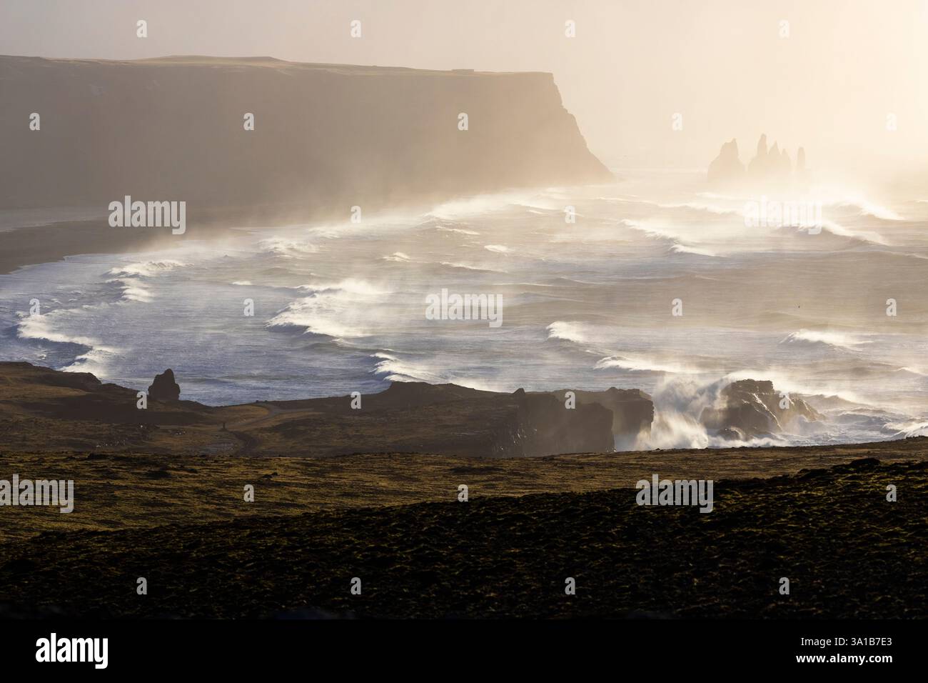 View of the sea stacks near Reynisfjara beach during sunrise in winter ...