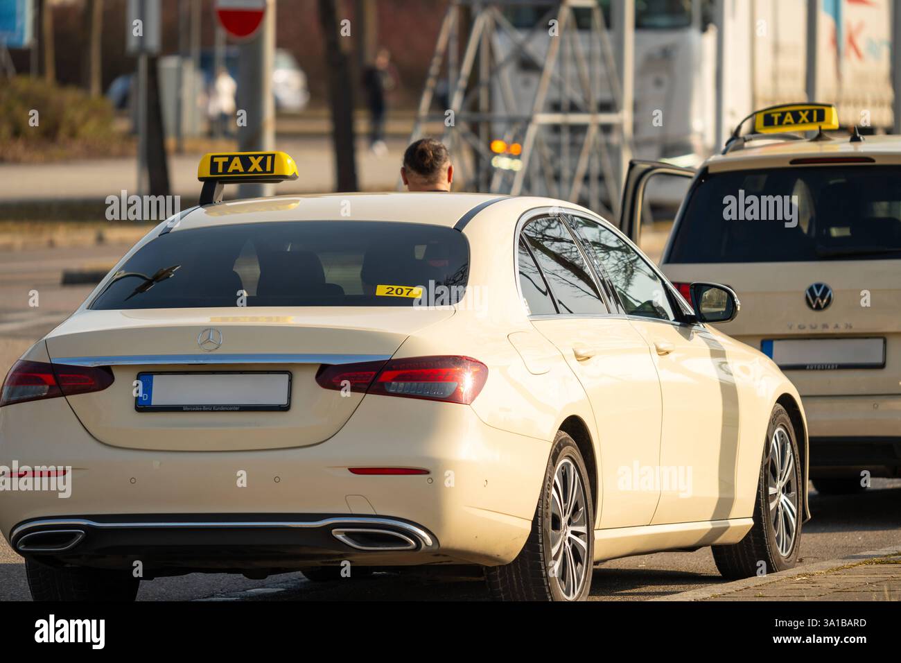 Augsburg, Bavaria, Germany - March 7, 2025: Two cabs wait at a cab rank ...