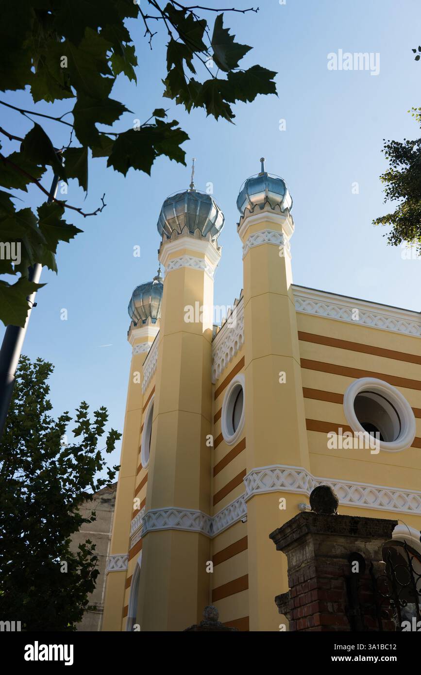 Synagogue of Cluj, Romania, shows its distinctive yellow facade with ...