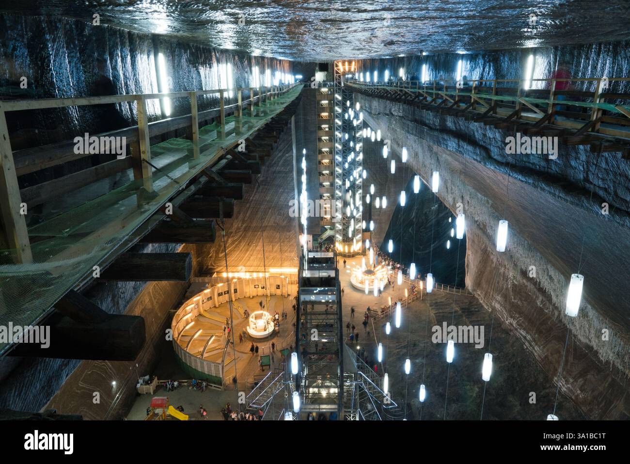 Visitors explore the Turda Salt Mine Stock Photo - Alamy