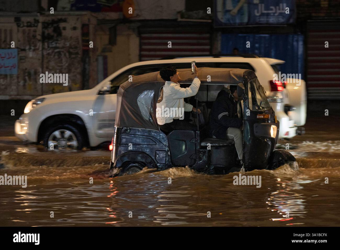 A man rides his toktok in the Sadr City area of Baghdad, Iraq, Friday ...