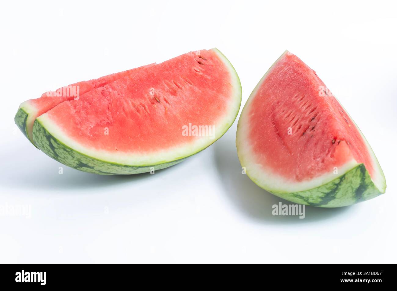 Two freshly cut watermelon slices, showing off their bright red ...