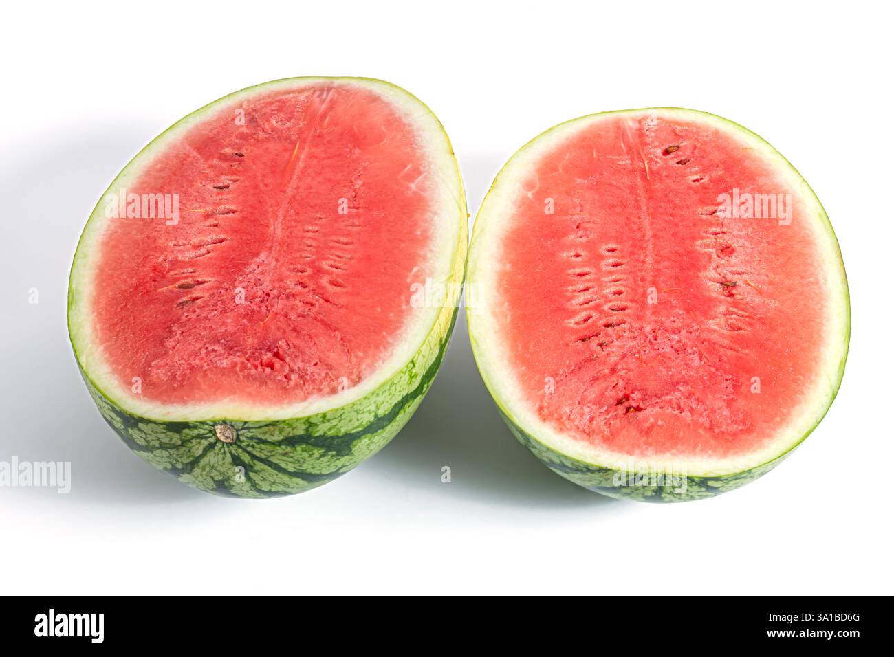A clear image of a fresh watermelon cut in half, showing its juicy red ...