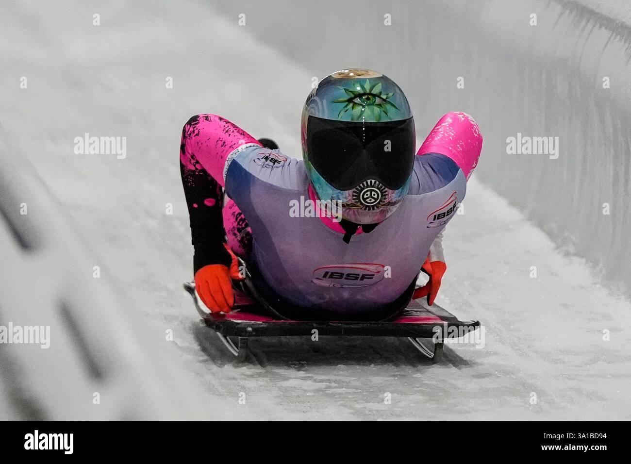 Kellie Delka, of Puerto Rico, slides during fourth run at the skeleton ...