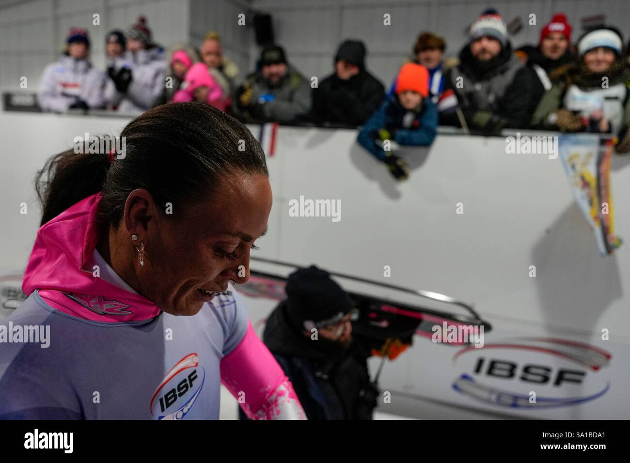 Kellie Delka, of Puerto Rico, walks of the course after sliding during fourth run at the ...