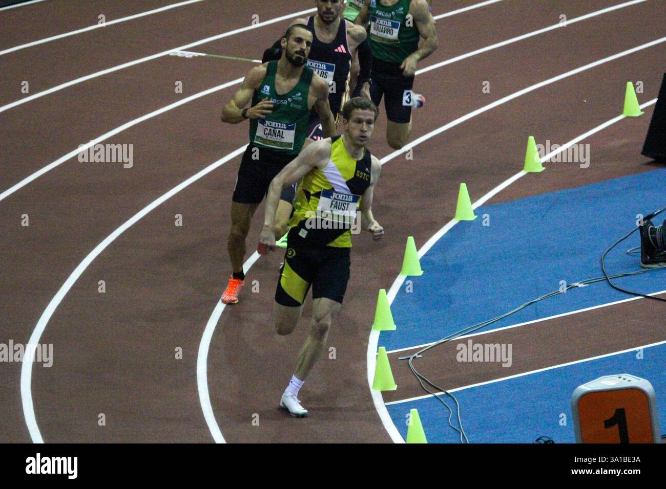 Madrid, Spain. 28th Feb, 2025. Athlete, Brian Faust (R) leads the 400m ...