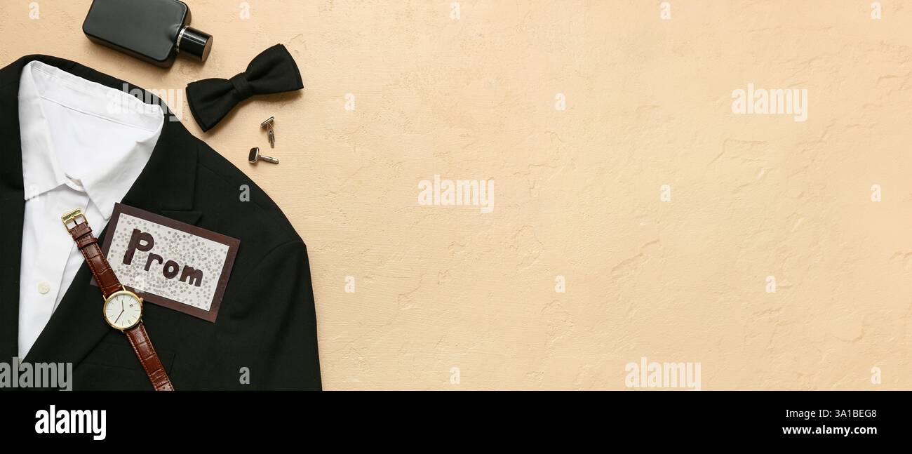 Word PROM, male suit, bowtie, perfume and watch on beige background ...