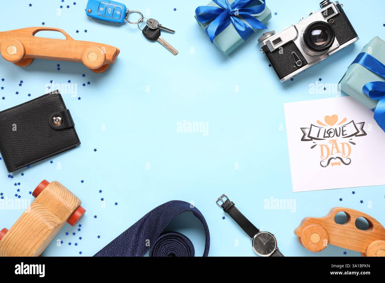 Frame made of different items and paper with text I LOVE DAD on blue ...