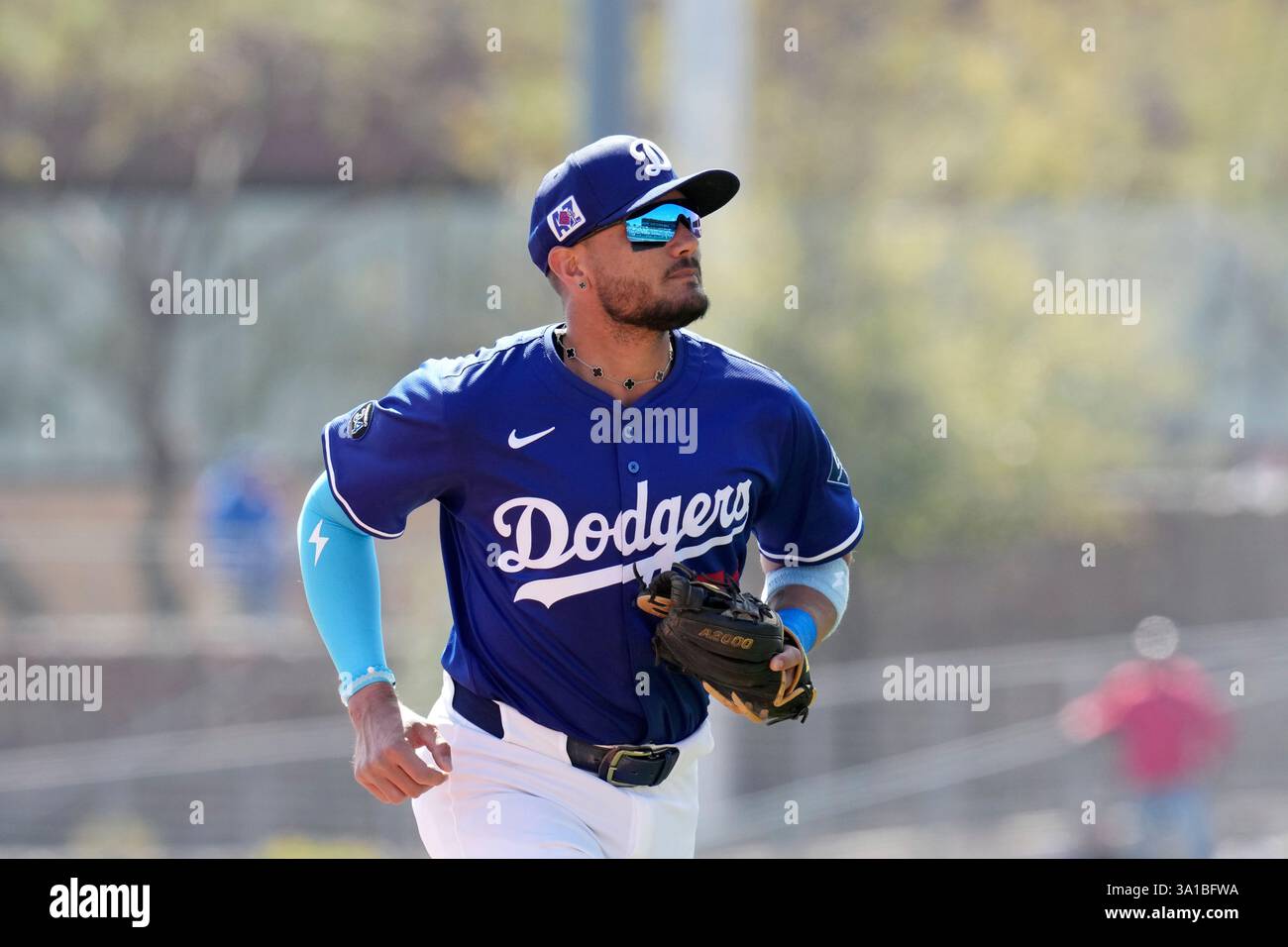 Los Angeles Dodgers second baseman Miguel Rojas runs back to the dugout ...