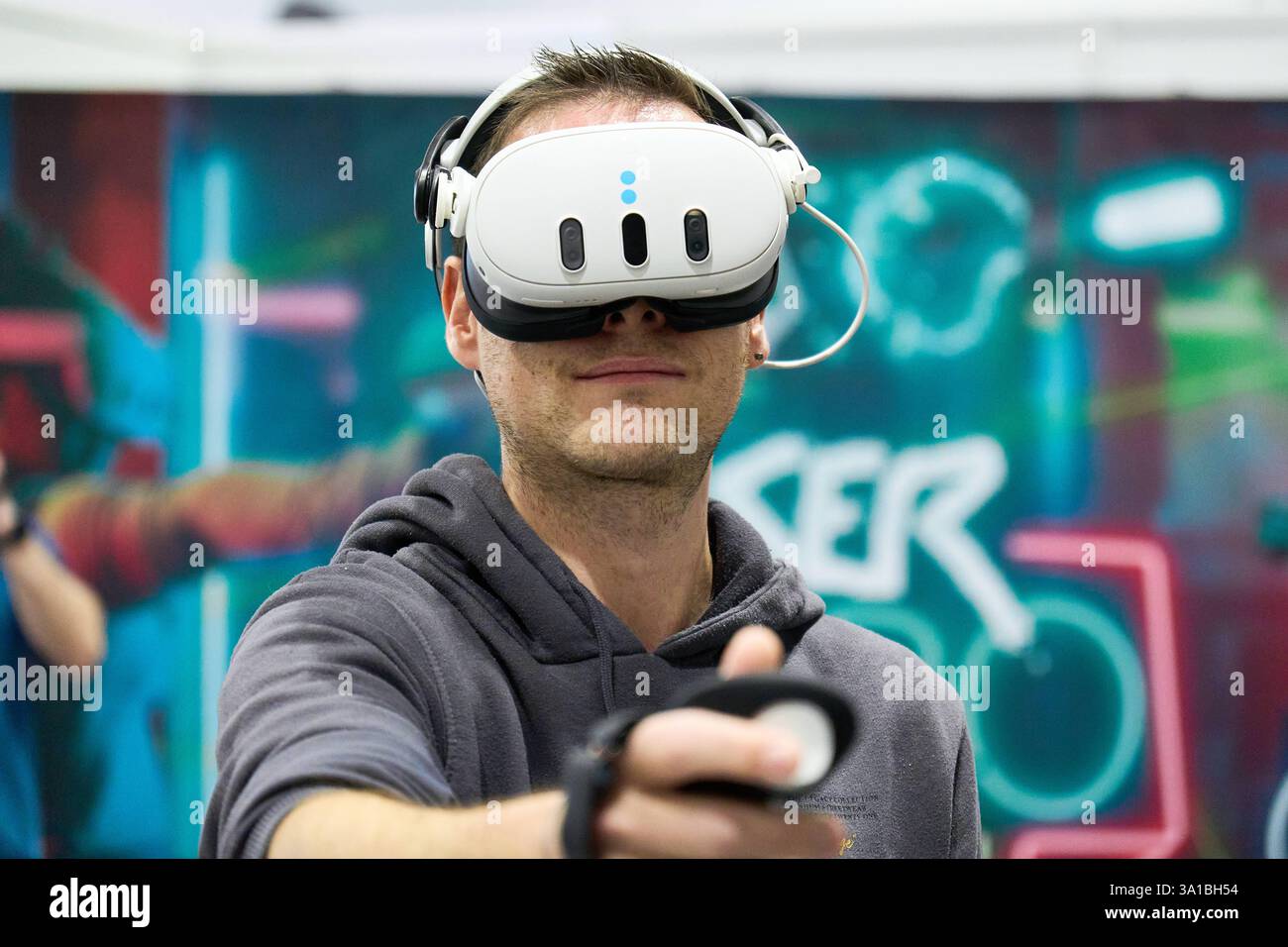 Augsburg, Bavaria, Germany - March 7, 2025: A player with VR headset ...