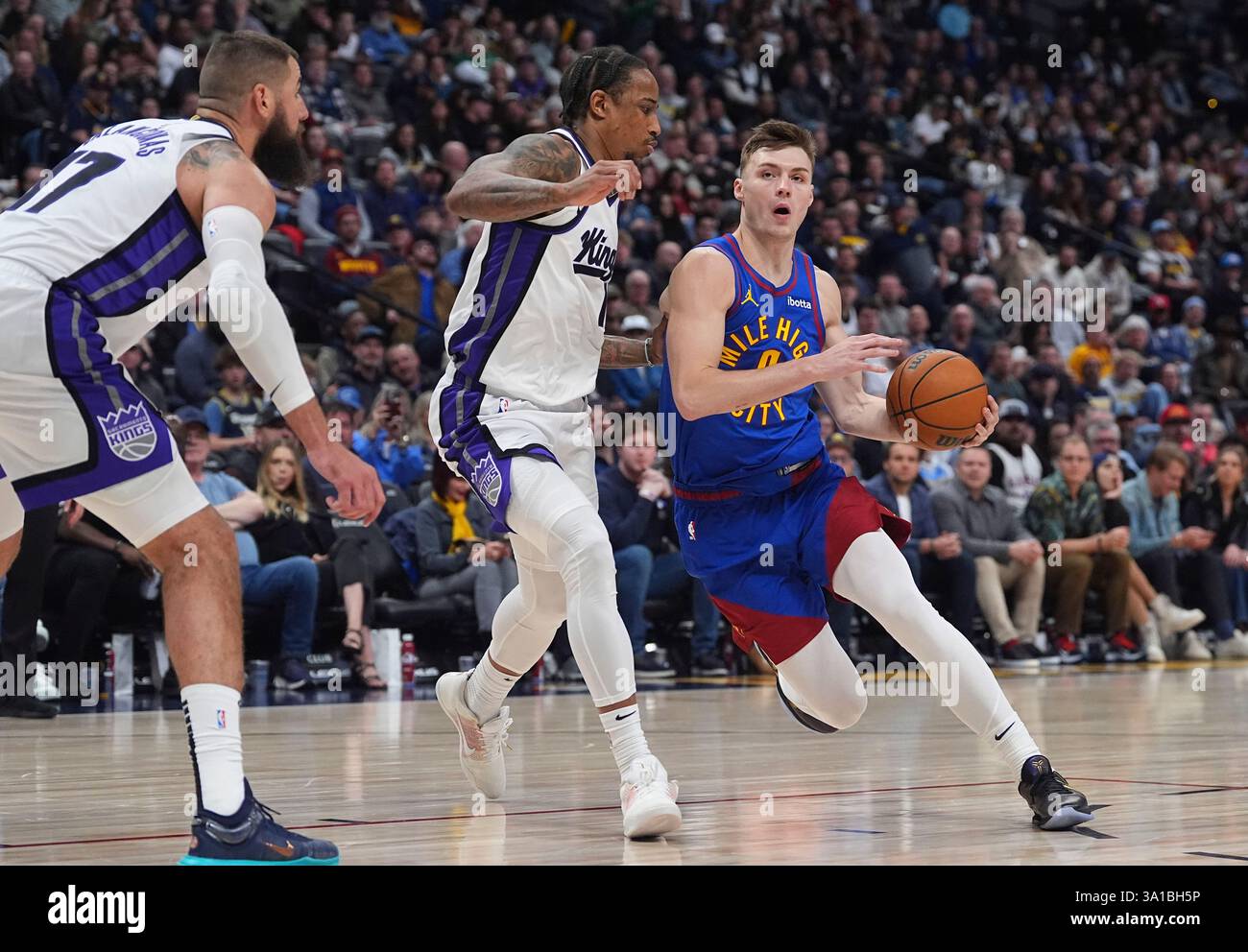 Denver Nuggets guard Christian Braun (0) drives past Sacramento Kings ...