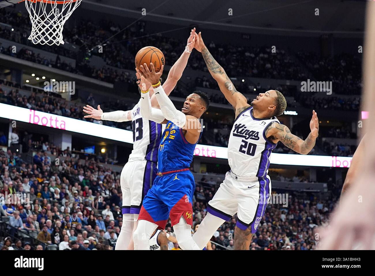 Denver Nuggets guard Russell Westbrook (4) drives to the basket between ...