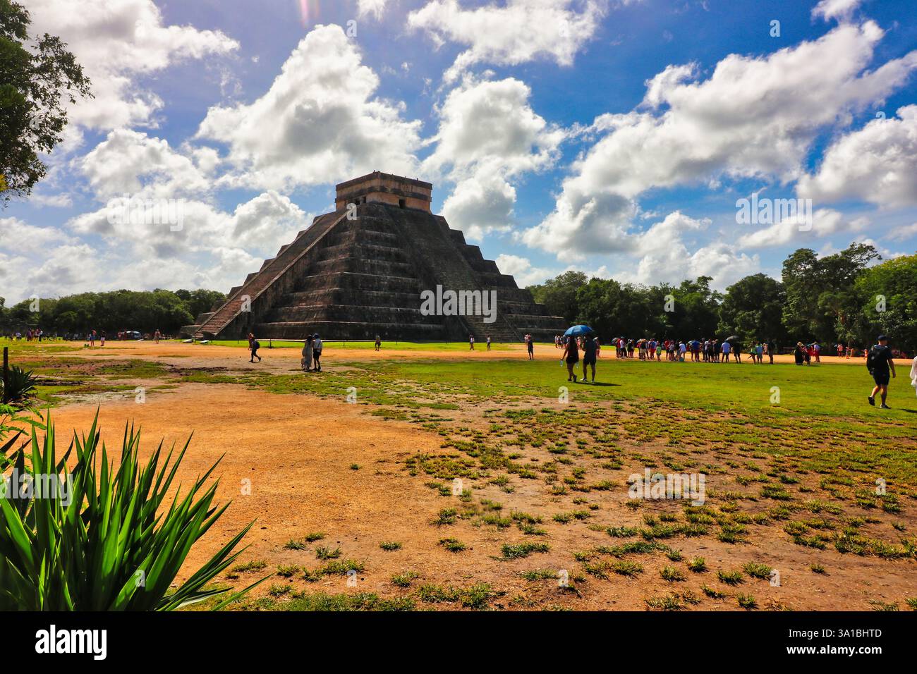 Cloudy yet bright skies over the Temple Pyramid of Kukulcan,El Castillo, Great Mayan ruins at ...