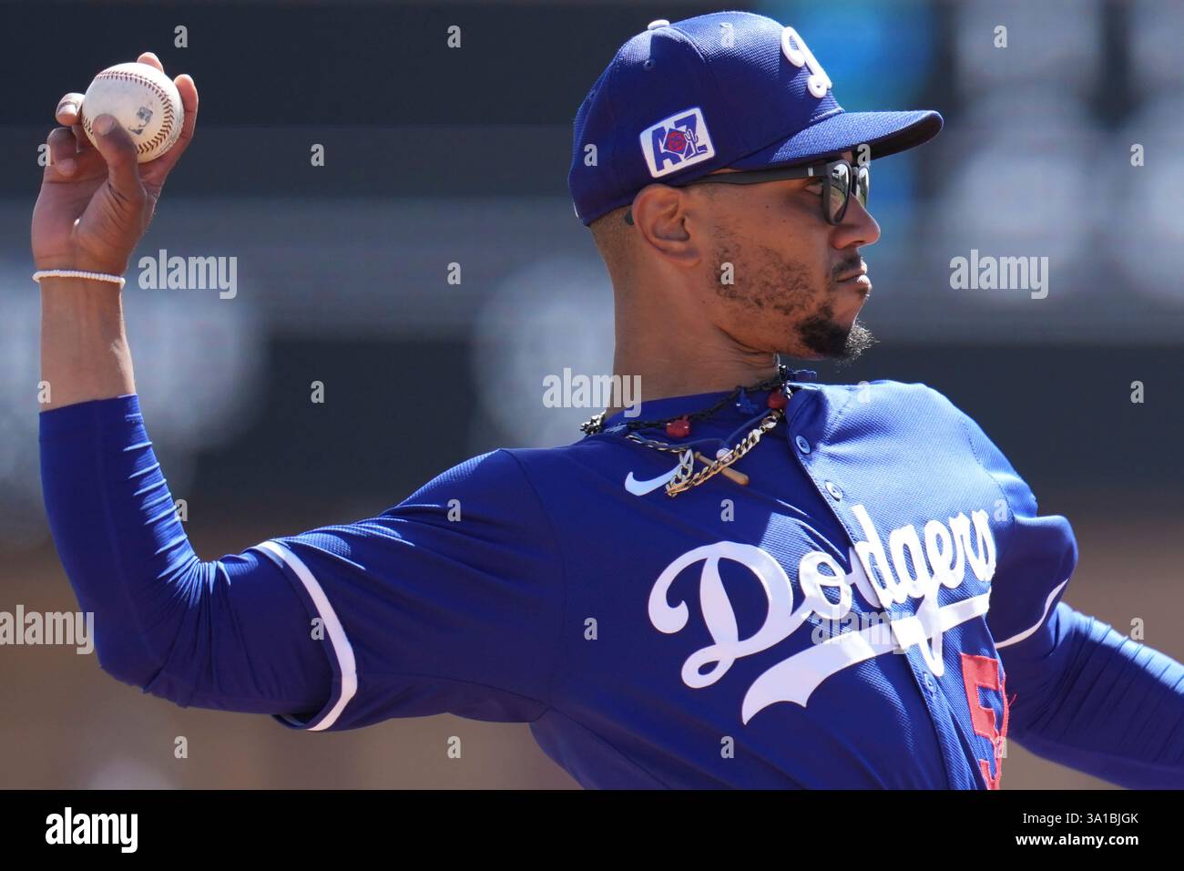 Los Angeles Dodgers shortstop Mookie Betts warms up during the third inning of a spring training ...