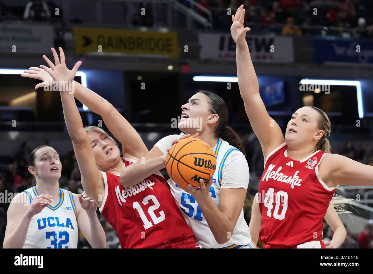 UCLA center Lauren Betts (51) drives on Nebraska forward Jessica Petrie ...