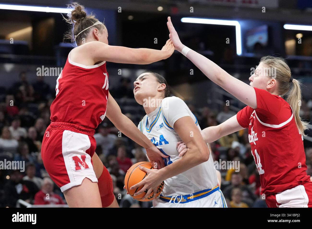 UCLA center Lauren Betts (51) drives on Nebraska guard Callin Hake ...