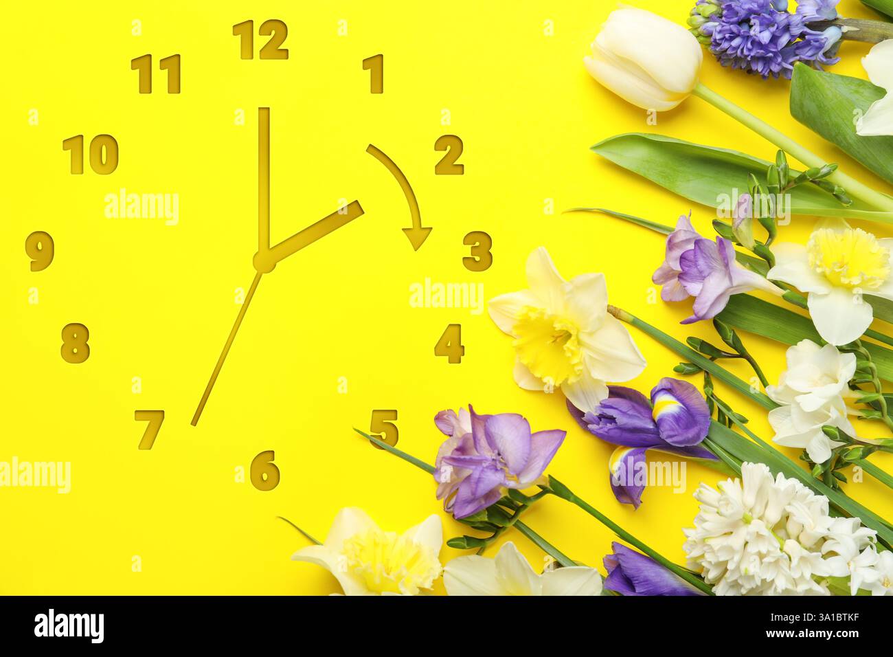 Clock and flowers on yellow background, top view. Arrow showing time ...