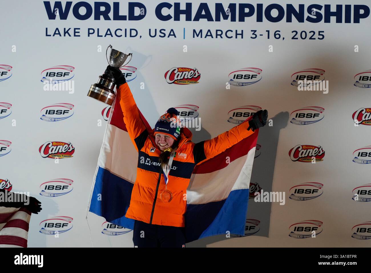 Kimberley Bos, of The Netherlands, celebrates her first place win ...
