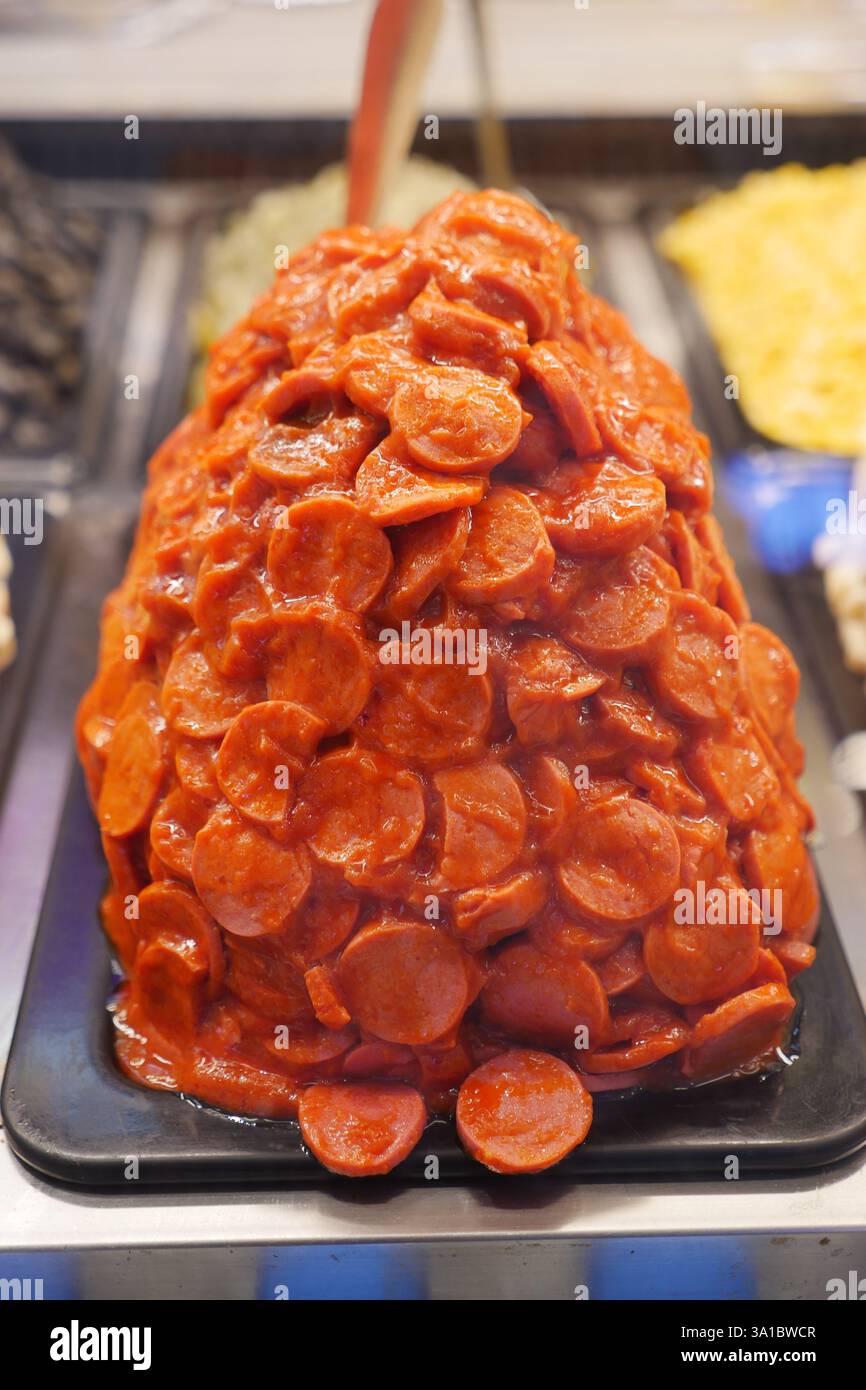 Mountain of red pepperoni displayed in a deli section Stock Photo - Alamy