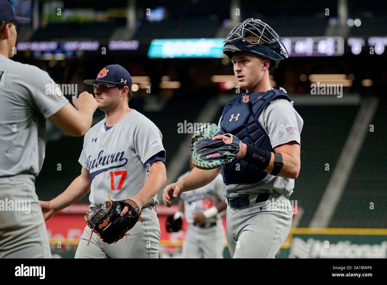Auburn Tigers catcher Ike Irish (18) fist bumps teammates during an ...