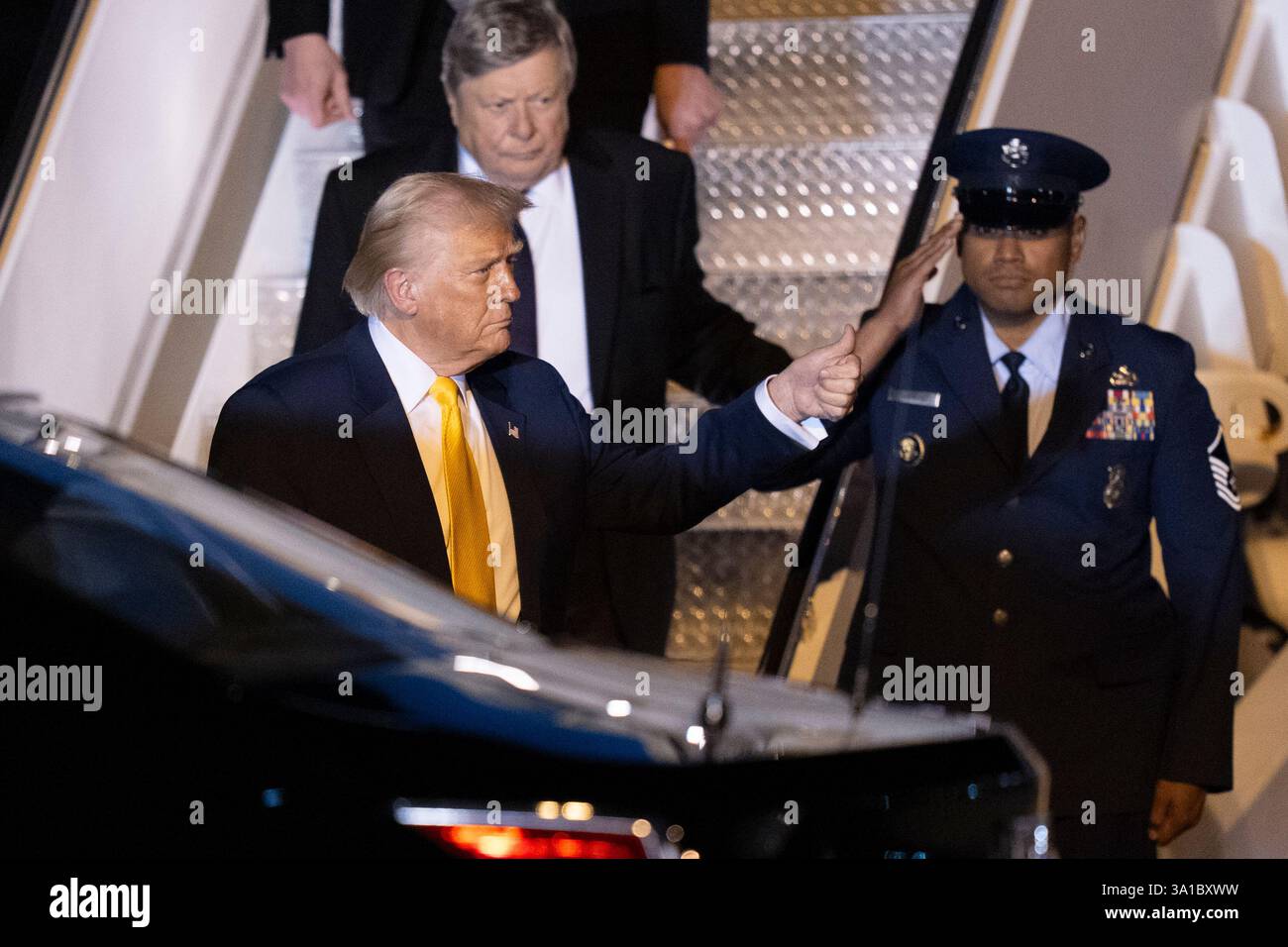 President Donald Trump followed by first lady Melania Trump's father ...