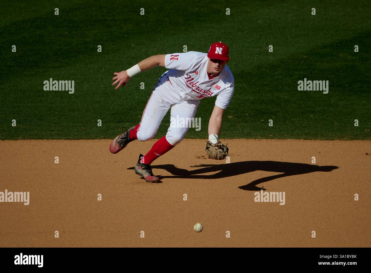 Nebraska Cornhuskers shortstop Dylan Carey (15) fields a ground ball ...