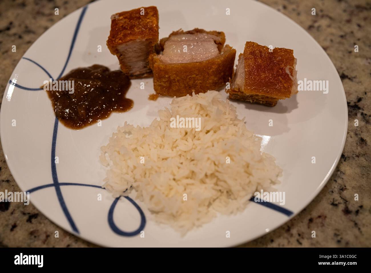 THis is the Famous Filipino Lechon Kawali in a plate with rice and ...