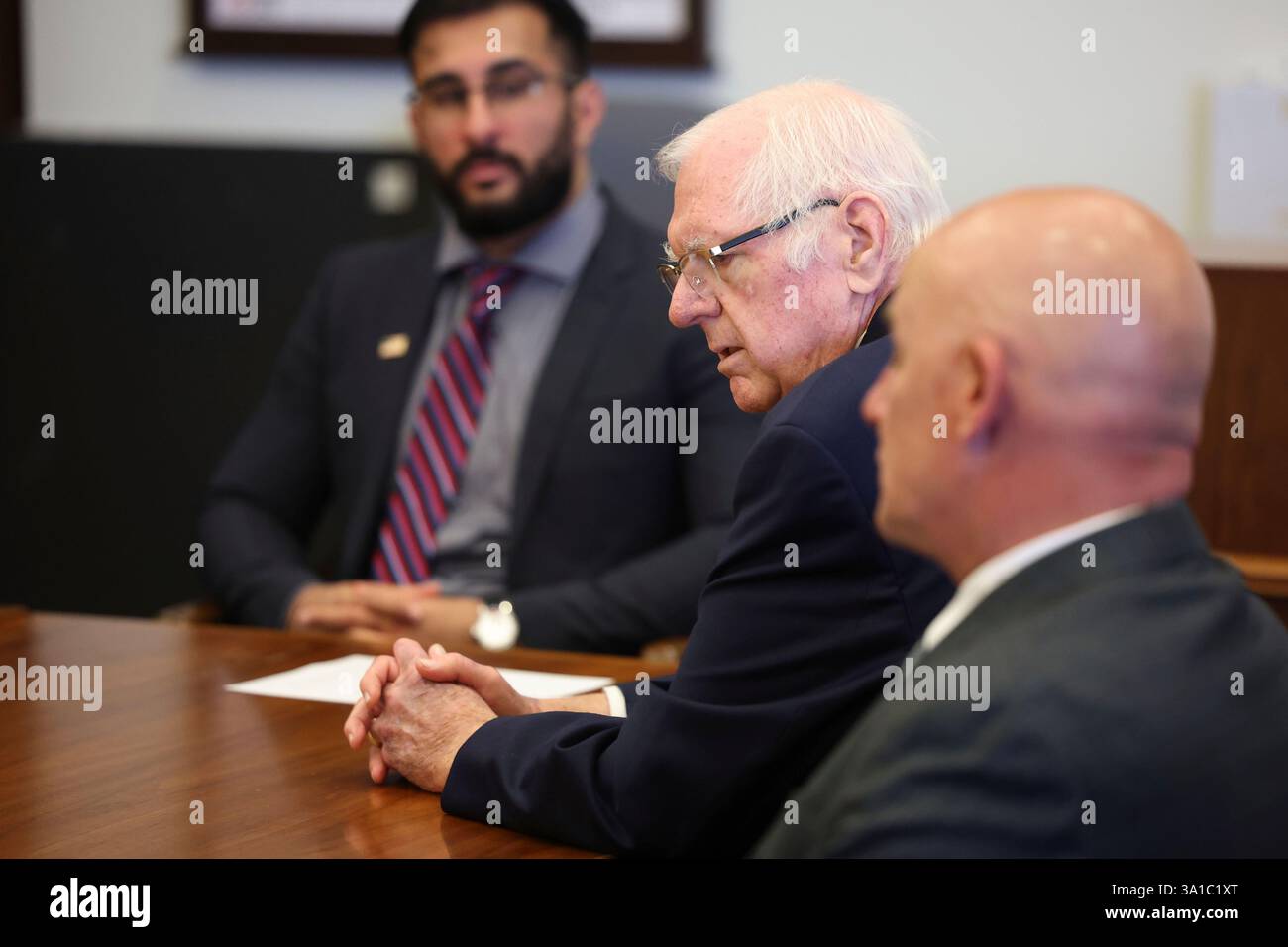 Judge Jeffrey Ferguson, center, listens during jury deliberations in ...