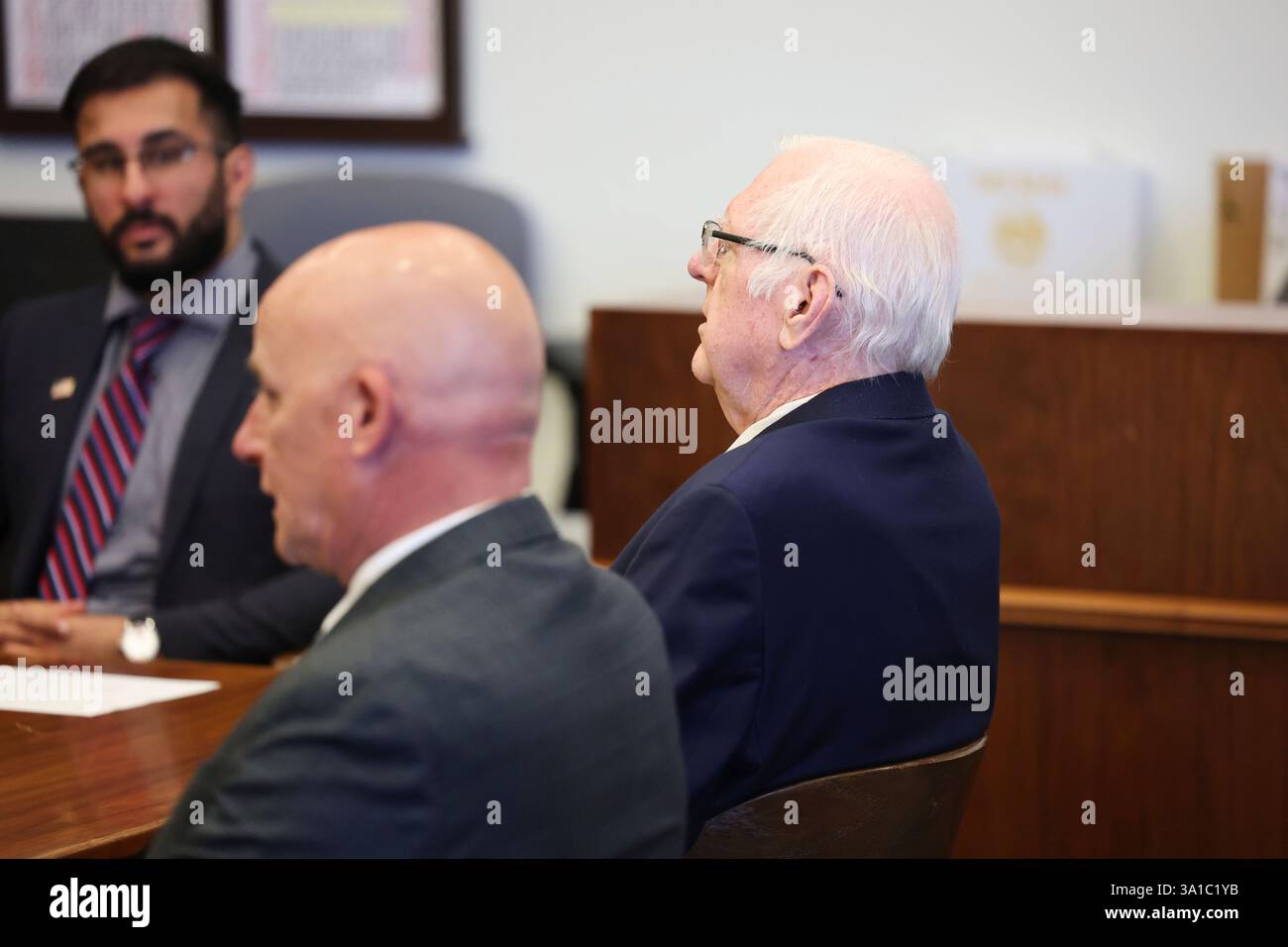 Judge Jeffrey Ferguson, right, listens during jury deliberations in his ...