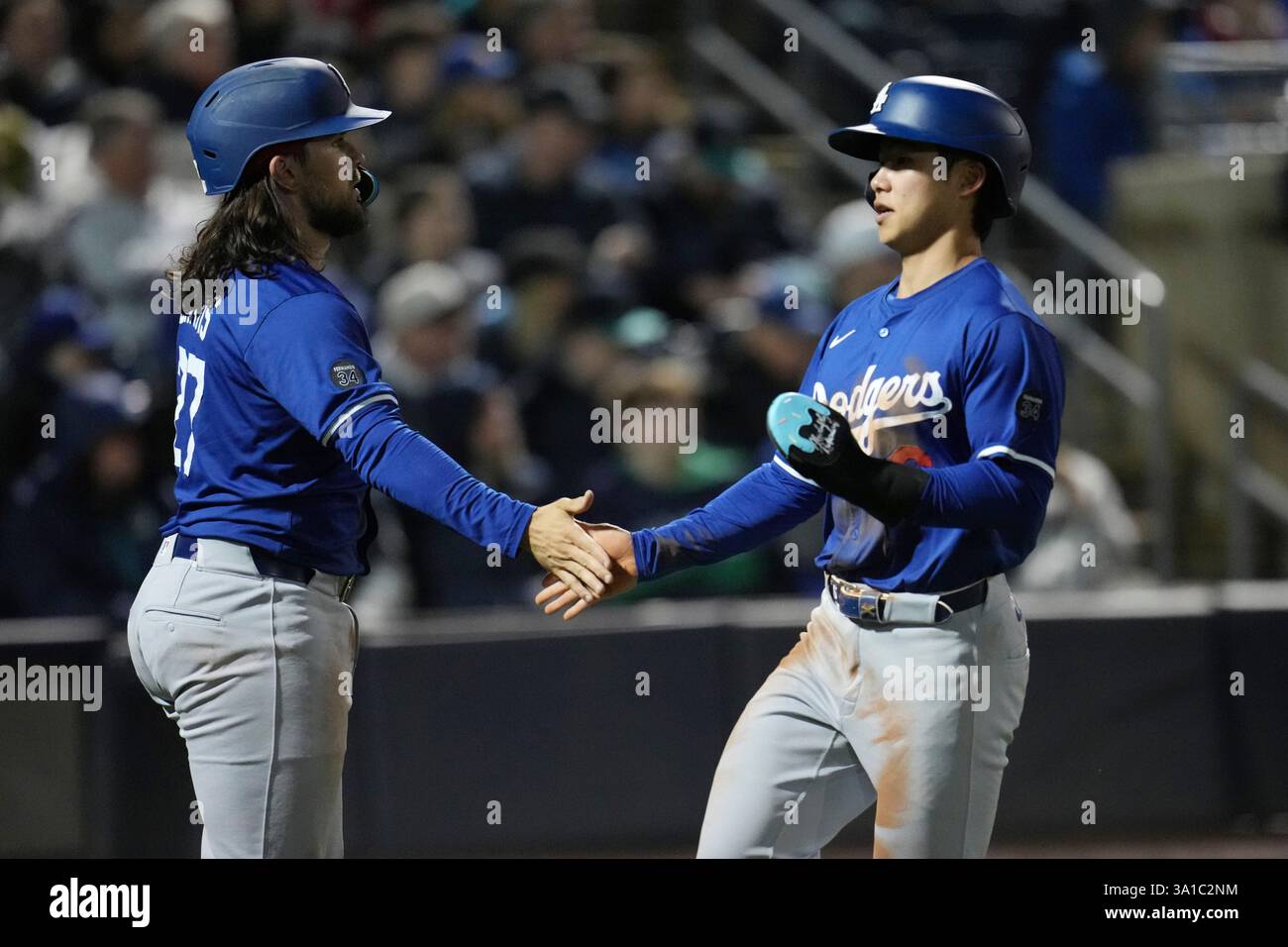 Los Angeles Dodgers' Hyeseong Kim, right, of South Korea and Michael ...