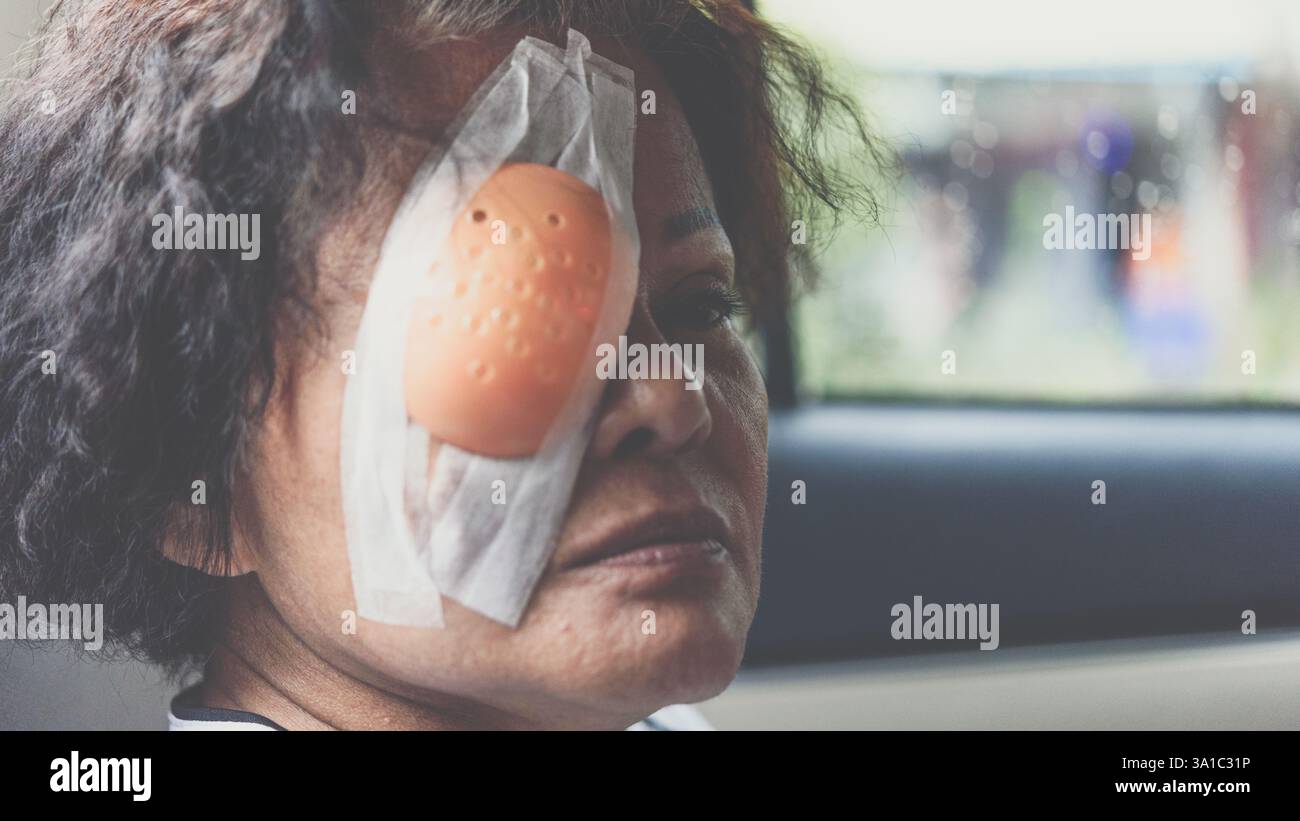 Patient asian elder women 60s with black hair and wrinkled on face show ...