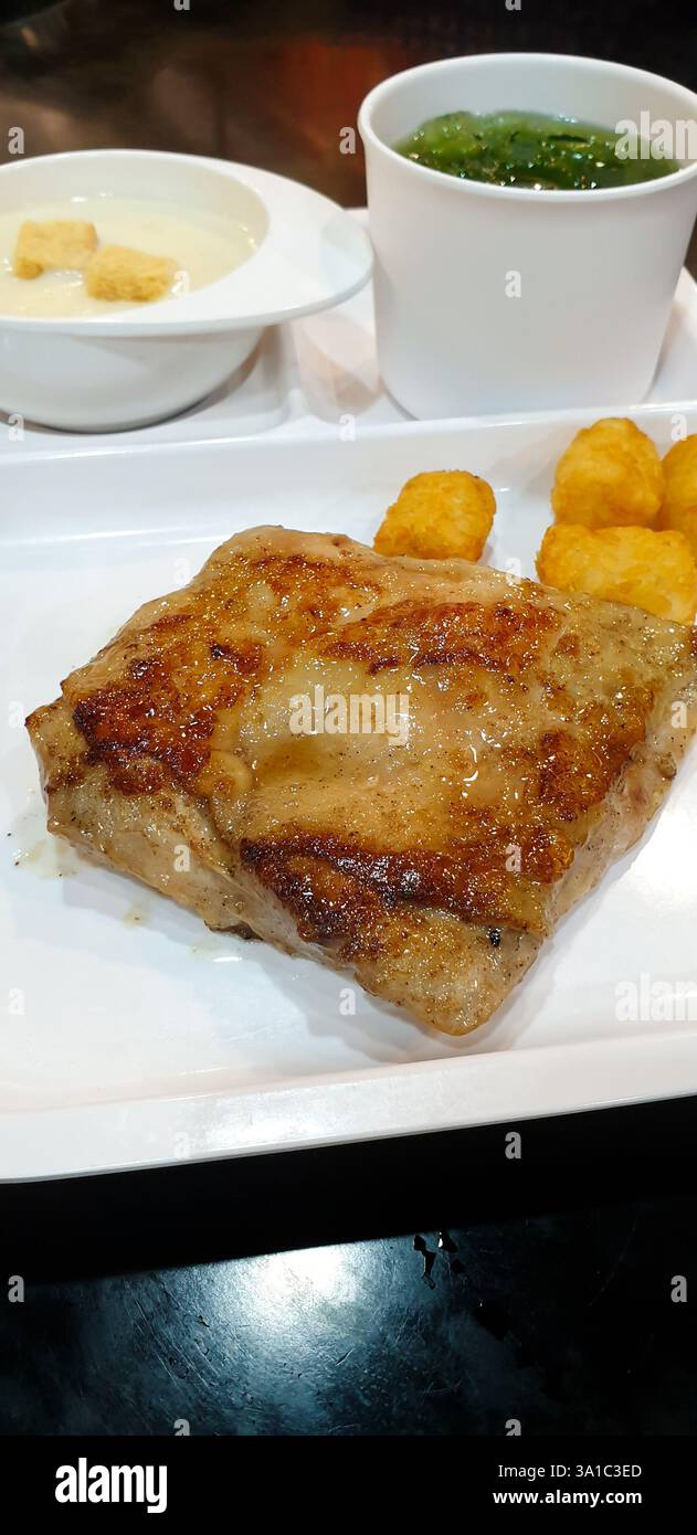 Meat steak (Beef or Pork steak) with mashed potatoes in white dish for ...