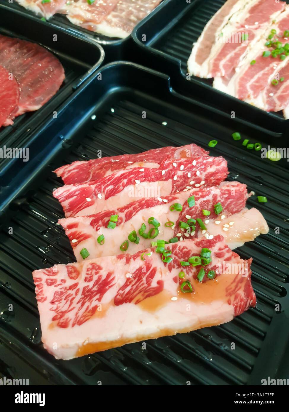 Grilled raw meat beef and pork (barbeque, bbq) a food cooking on wagyu ...