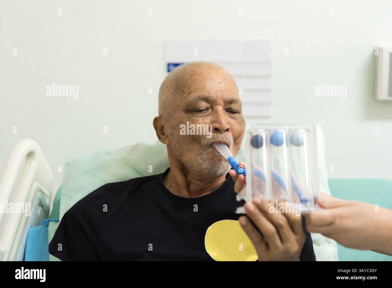 Patient asian elder man 70s use Incentive Spirometer or Triball Tri ...