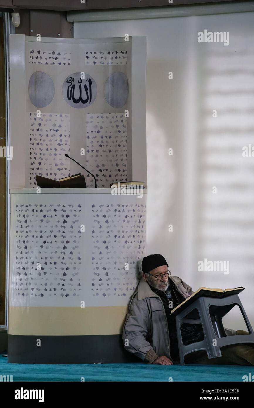 Istanbul, Turkey, Turkiye. Sakirin Mosque. Worshiper Reading the Quran ...
