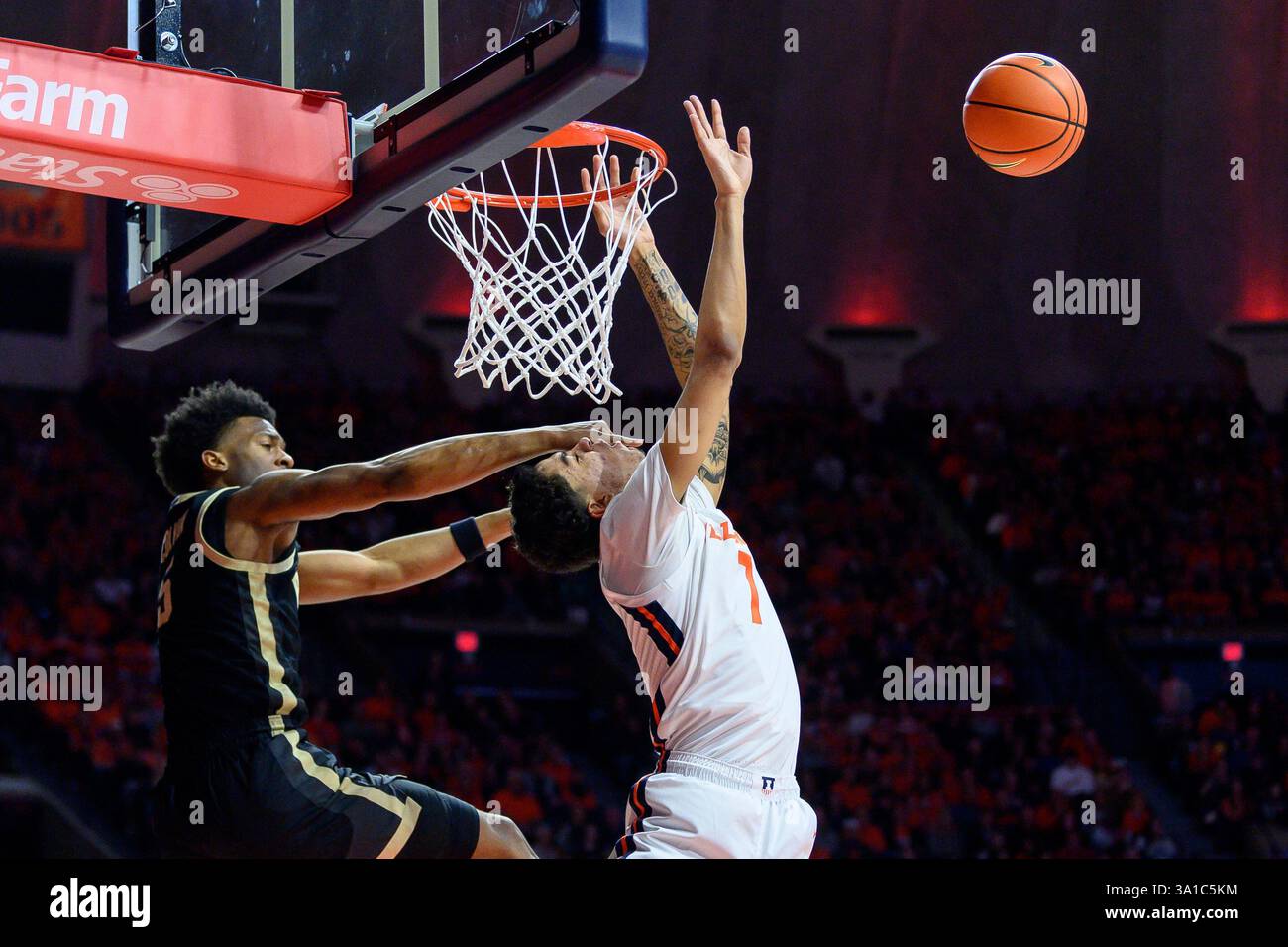Purdue's Myles Colvin fouls Illinois' Will Riley during an NCAA college ...