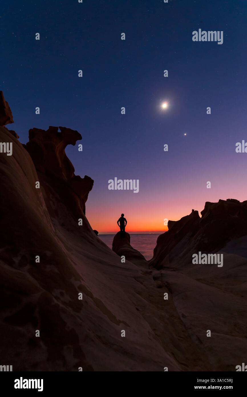 Moon, Venus and Saturn at dusk, as seen from a rocky shore in the ...