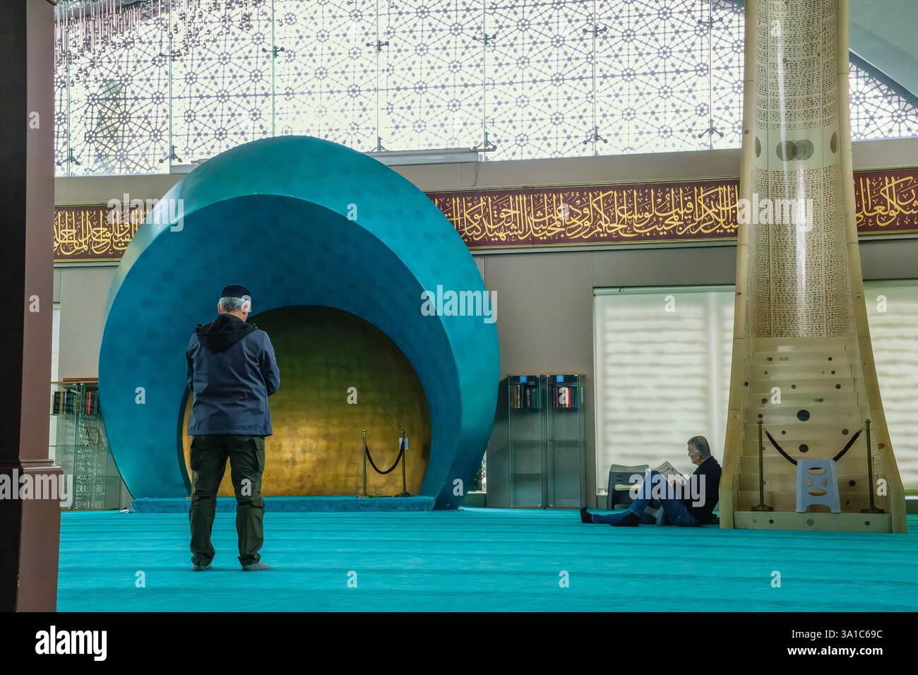 Istanbul, Turkey, Turkiye. Sakirin Mosque. Men Praying and Reading next ...