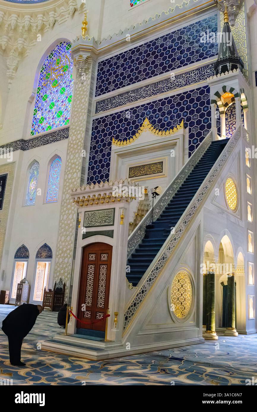 Istanbul, Turkey, Turkiye. Grand Camlica Mosque Minbar. Man Praying in ...