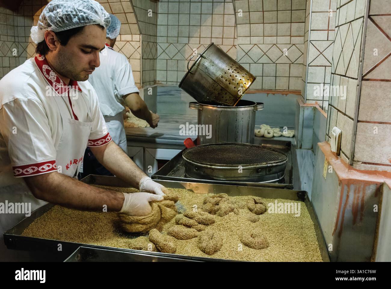 Istanbul, Turkey, Turkiye. Baker Rolling Simit, Traditional Turkish ...
