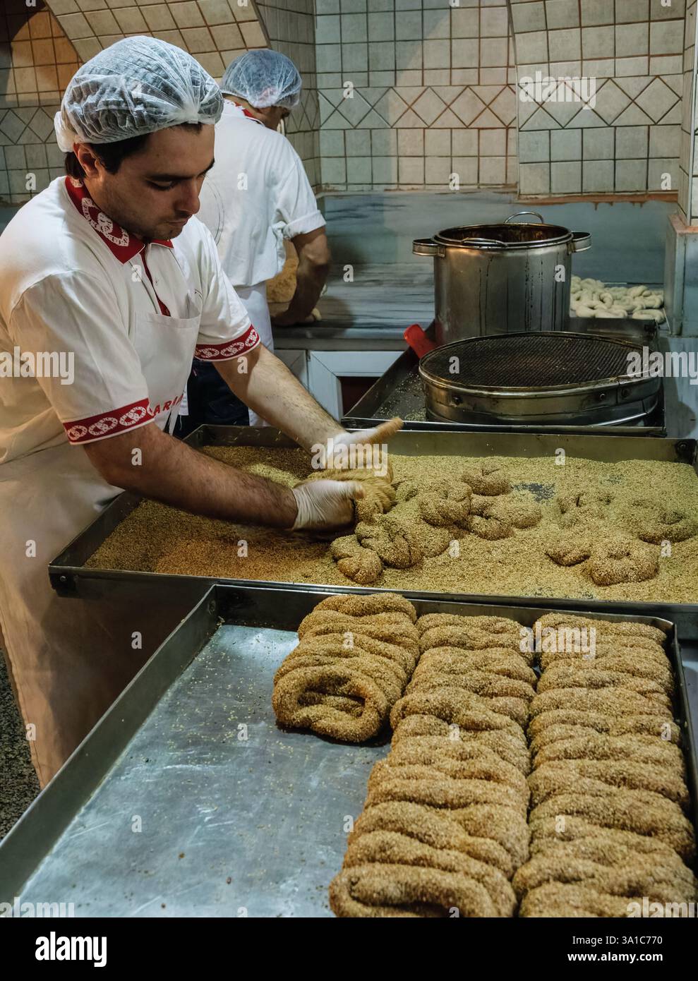 Istanbul, Turkey, Turkiye. Baker Rolling Simit, Traditional Turkish ...