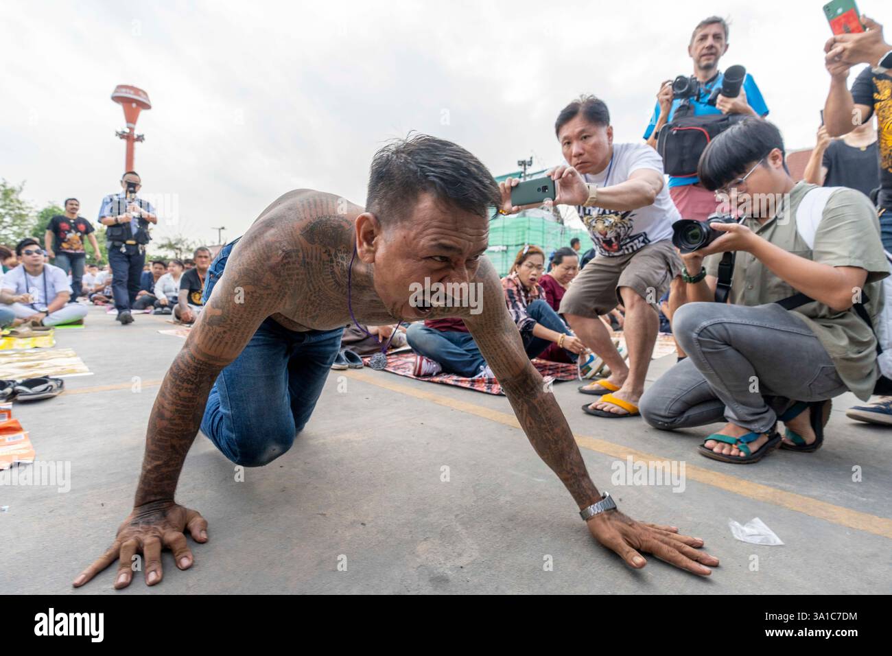 March 8, 2025, Bang Phra, Nakhon Pathom, Thailand: A devotee bearing ...