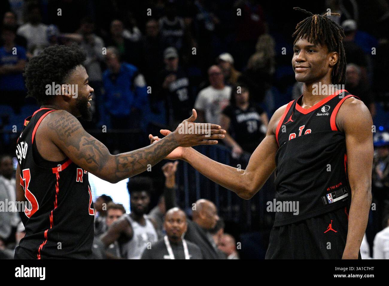 Toronto Raptors guard Jamal Shead (23) and guard Ja'Kobe Walter, right ...