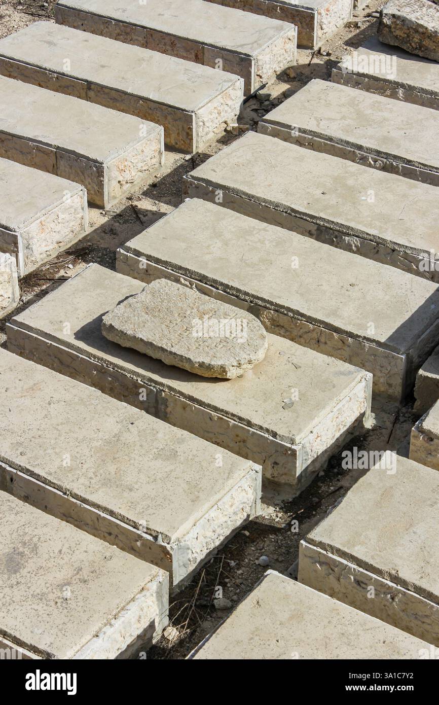 A concrete slab placed on a tomb in the Jewish Cemetery in Jerusalem ...